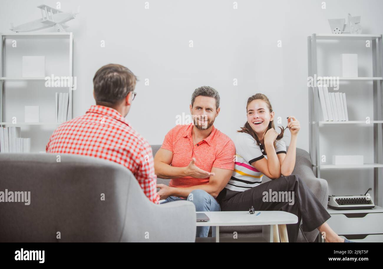 Family psychologist. Psychotherapy with young couple. Couple telling ...