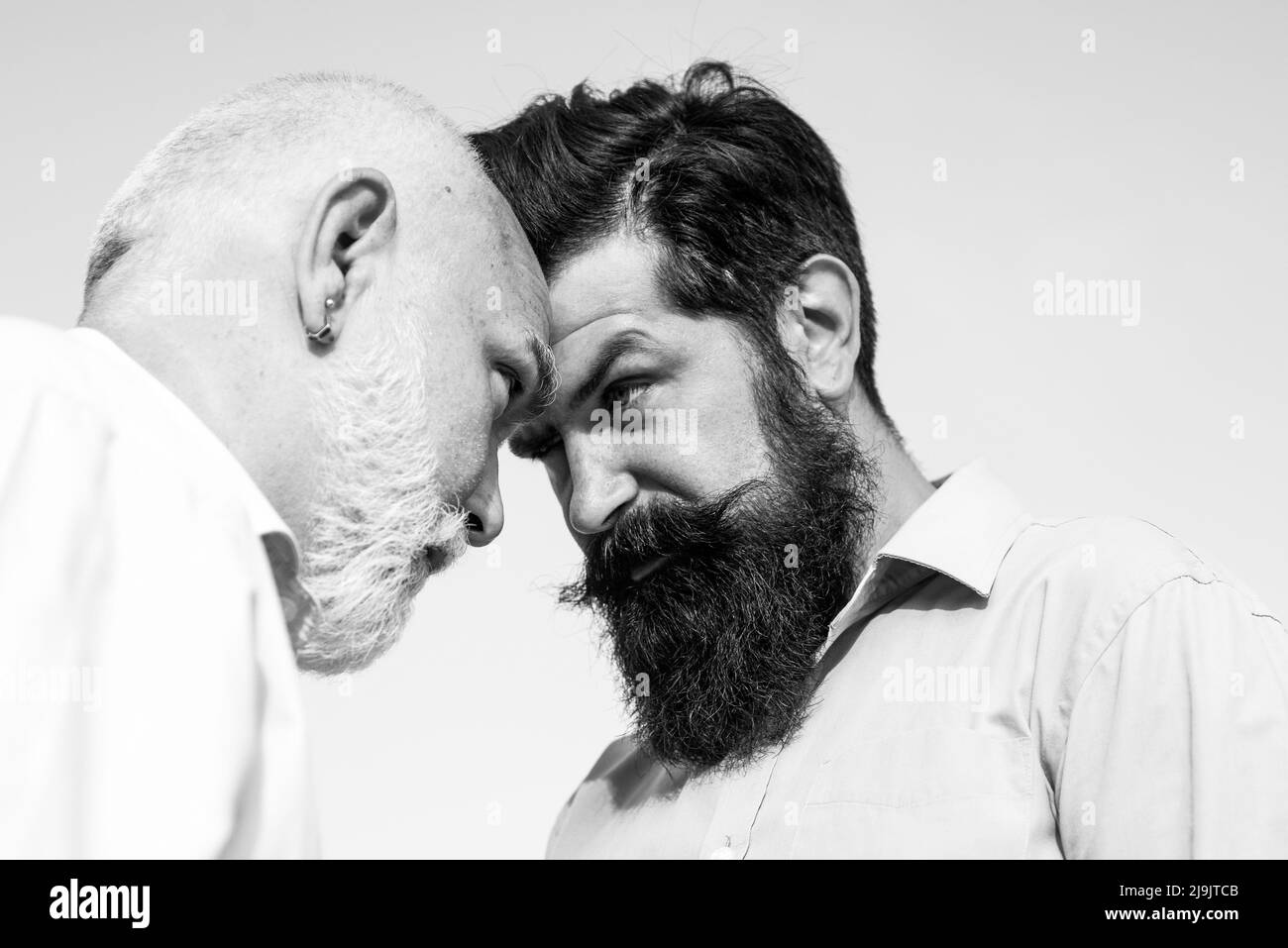 Men generations: grandfather and father together. Elderly Senior man ...