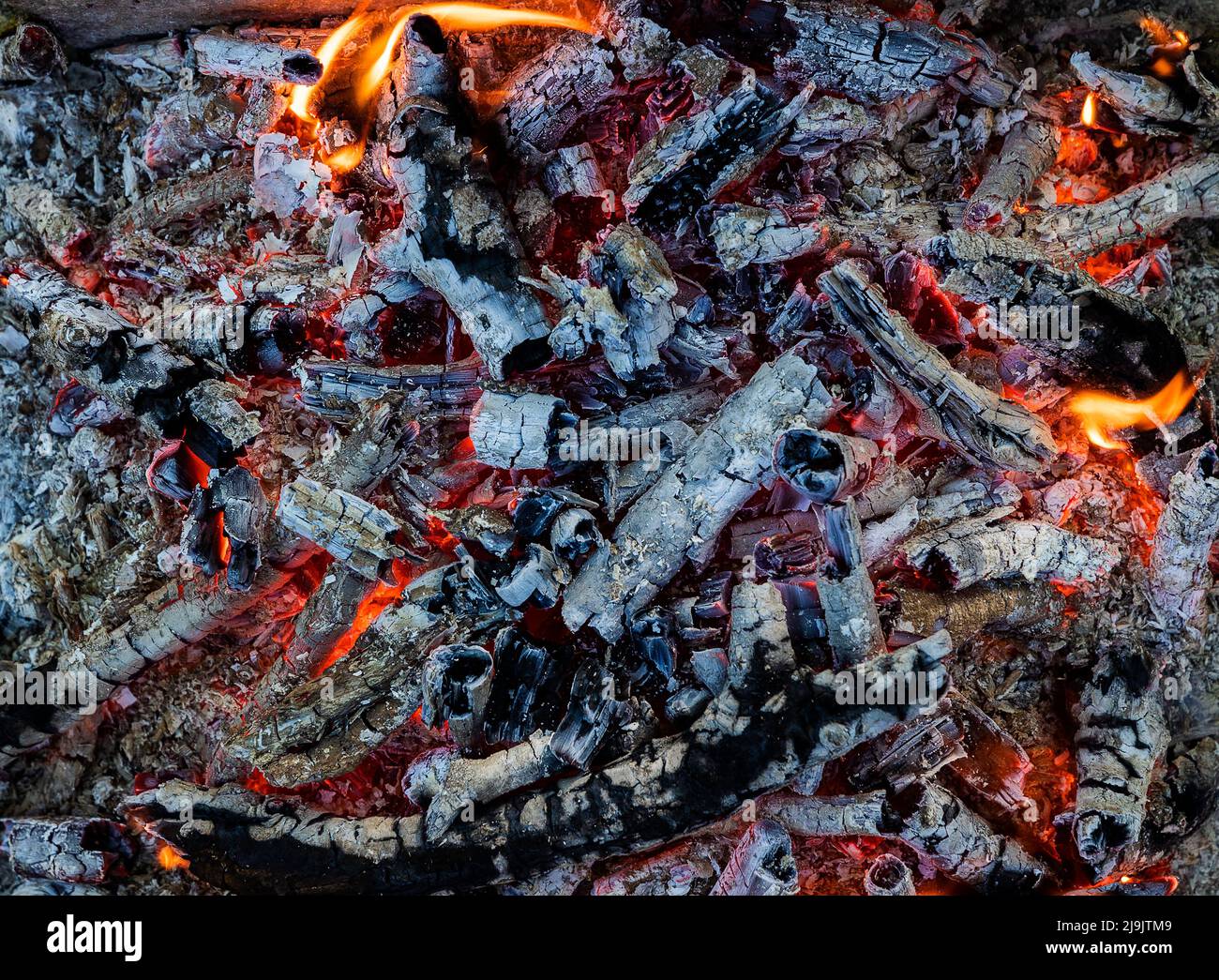 Smoldering coals from a fire Stock Photo - Alamy