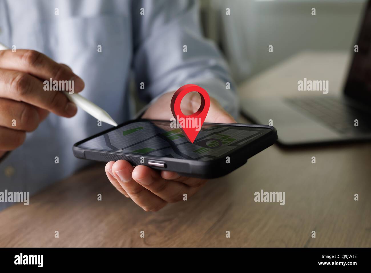 hand using a smartphone Holding GPS Map to Route Destination network ...