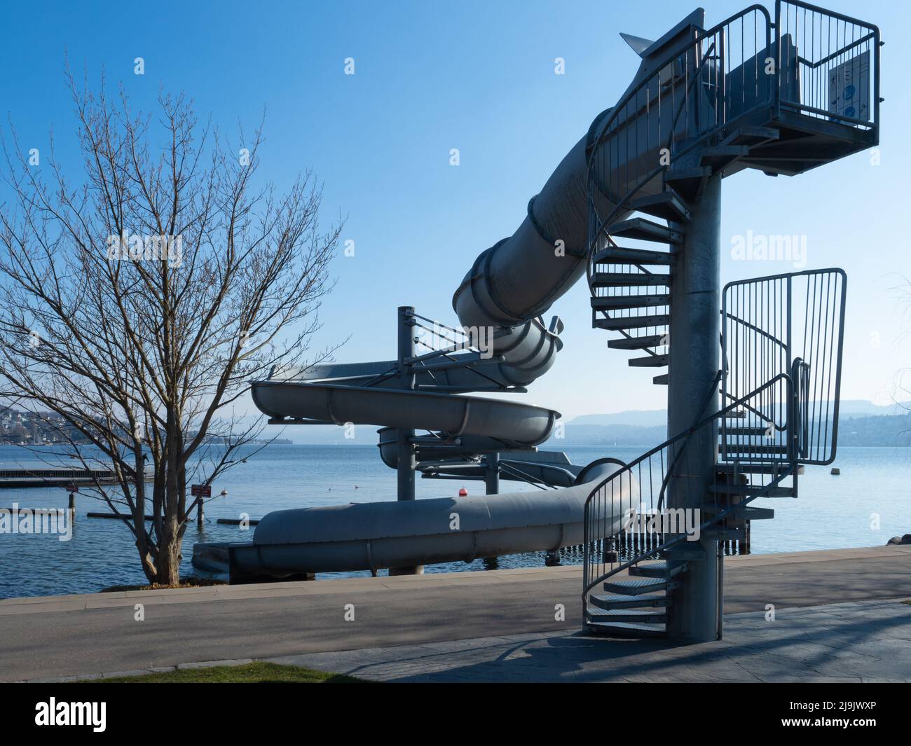 Zurich, Switzerland - March 5th 2022: An empty waterslide into the lake ...
