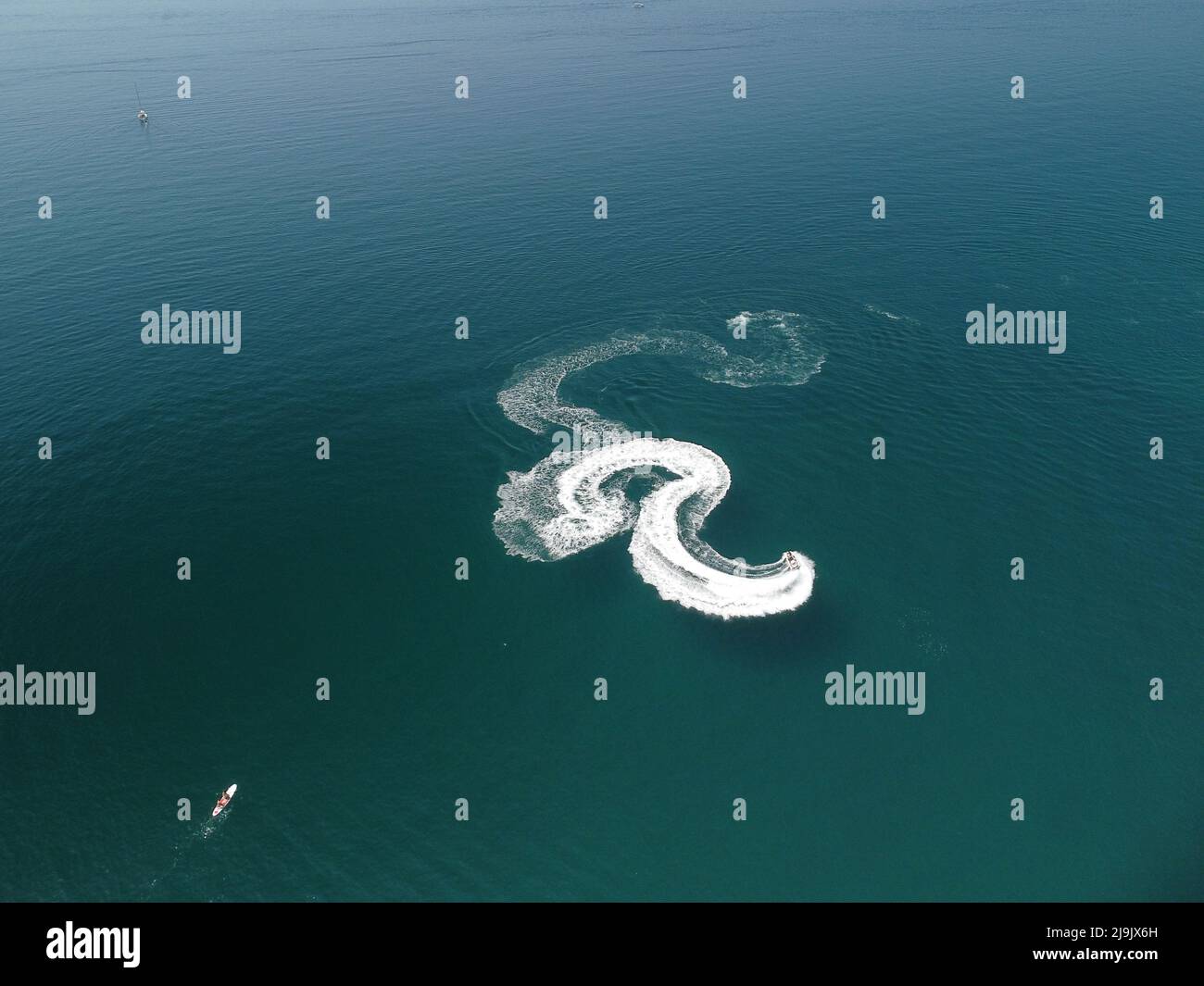 Aerial top down view of water foam trace with nice deep blue shade of ...