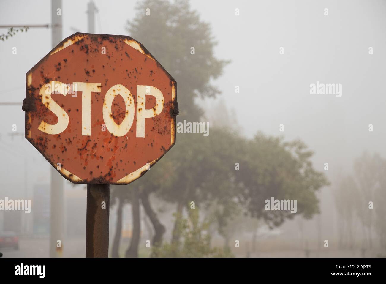 stop sign old rusty morning in the fog in the city of Dnipro drove ...