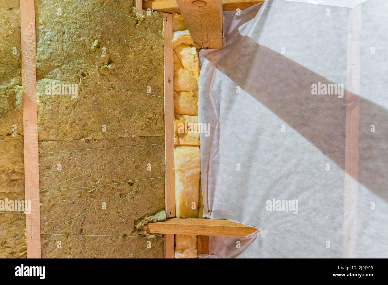 The roof is insulated with green mineral wool and yellow glass wool and ...