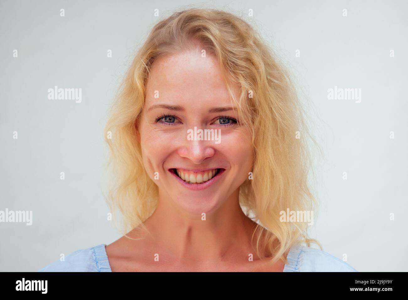 close up portrait of young woman with long blond damaged dry hair split ...