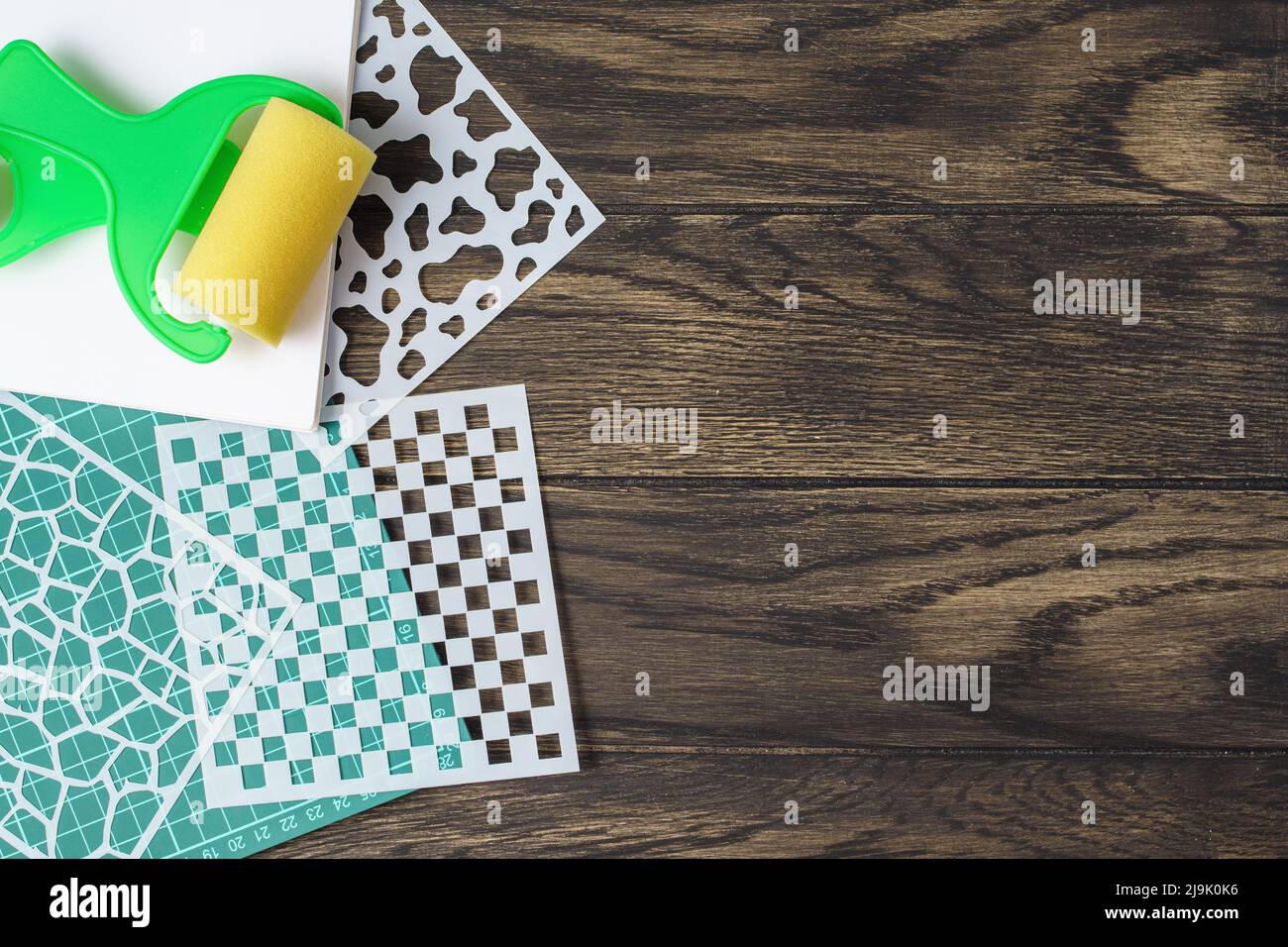 Stencils and a paint roller. Accessories and tools of the artist for ...