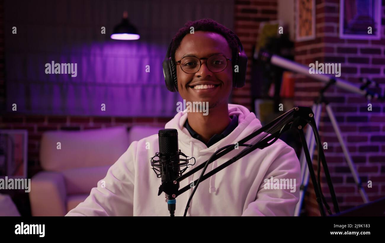 African man reading into microphone hi-res stock photography and images ...