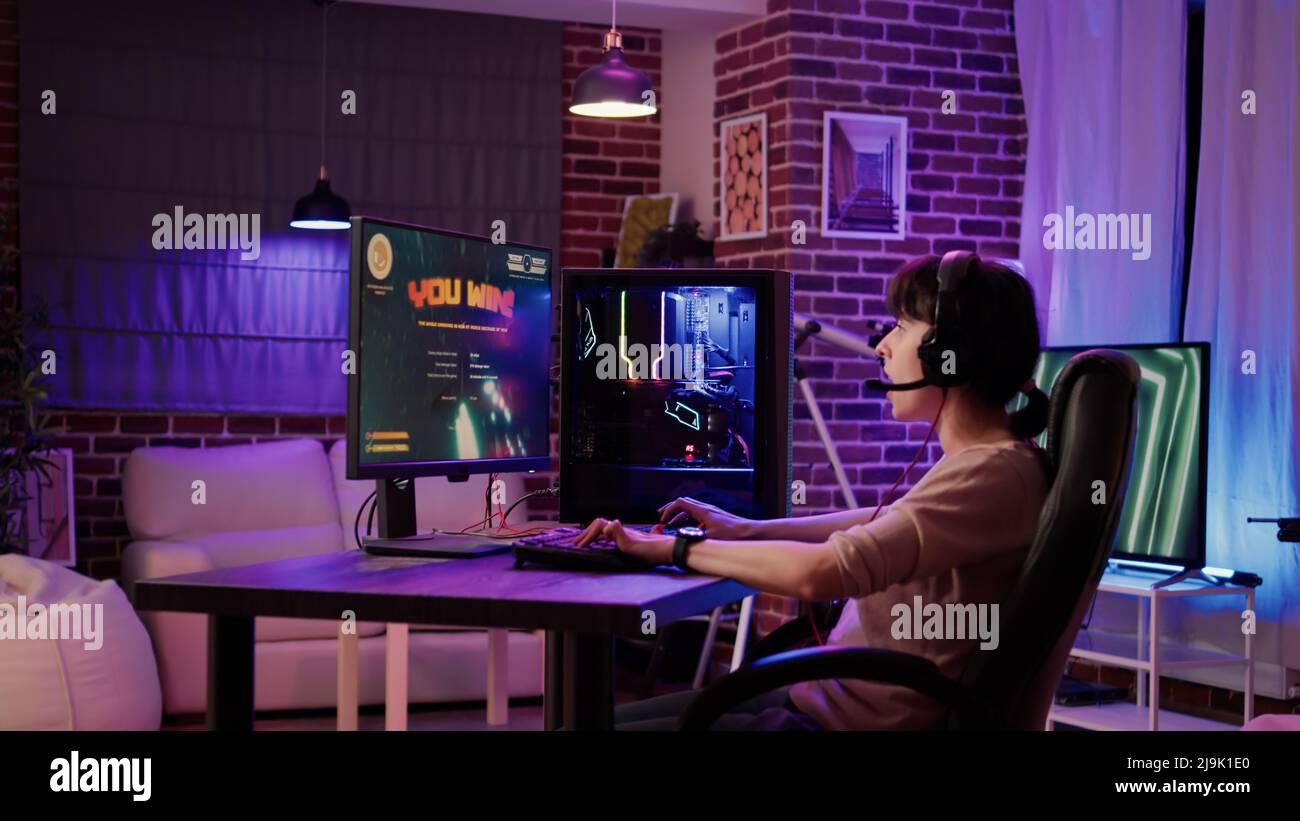 Caucasian woman celebrating winning first place in action game online ...