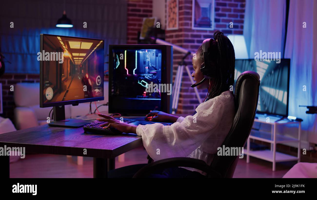 African american gamer girl streaming first person shooter tournament ...