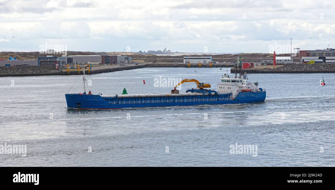 Medium sized blue cargo ship sailing in a dutch port Stock Photo - Alamy
