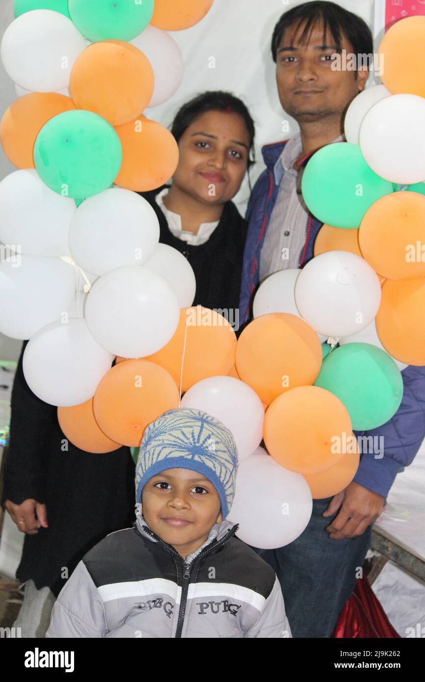 Indian Portrait with tri colour balloons - Saluting national Flag and ...