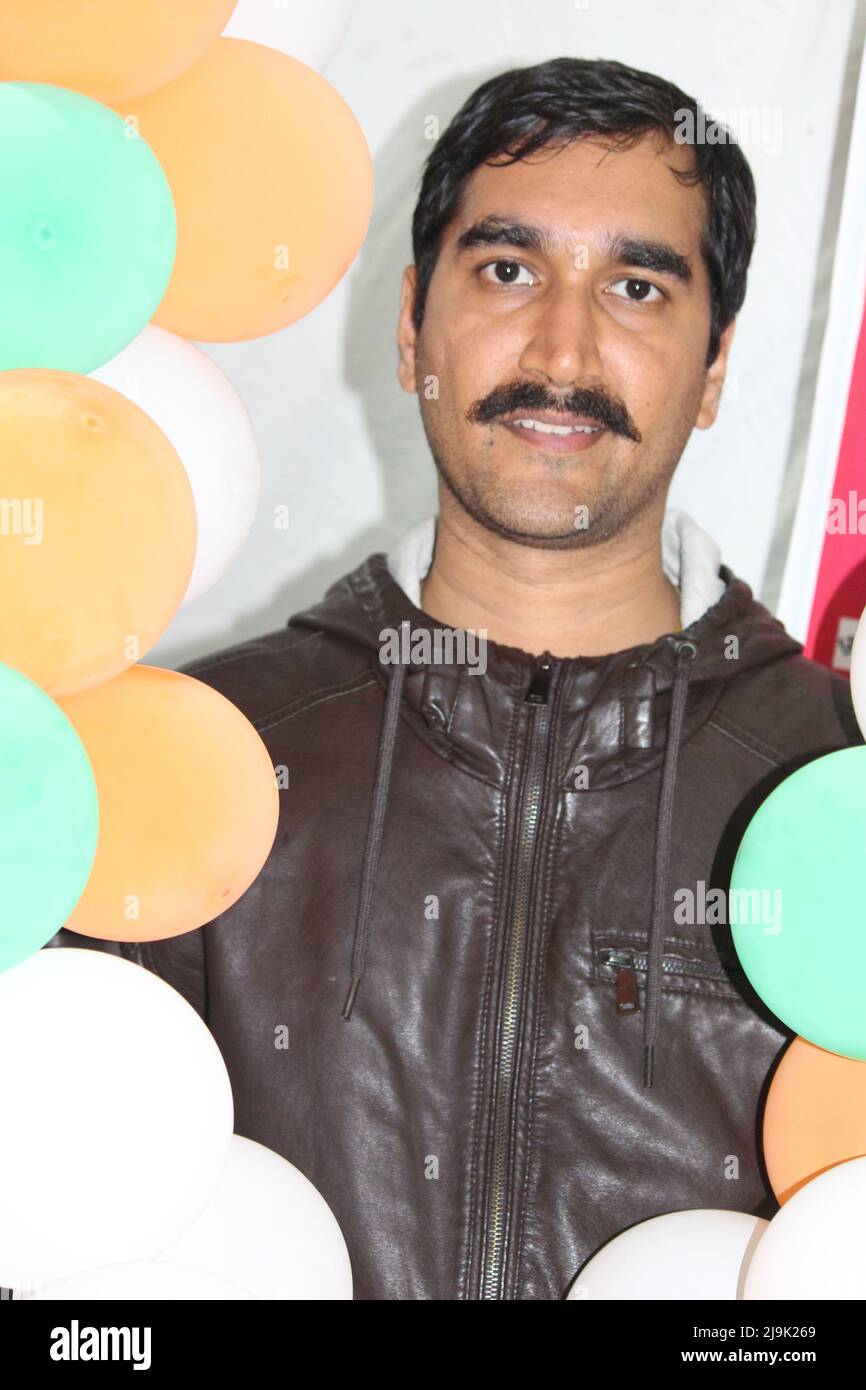 Indian Portrait with tri colour balloons - Saluting national Flag and ...