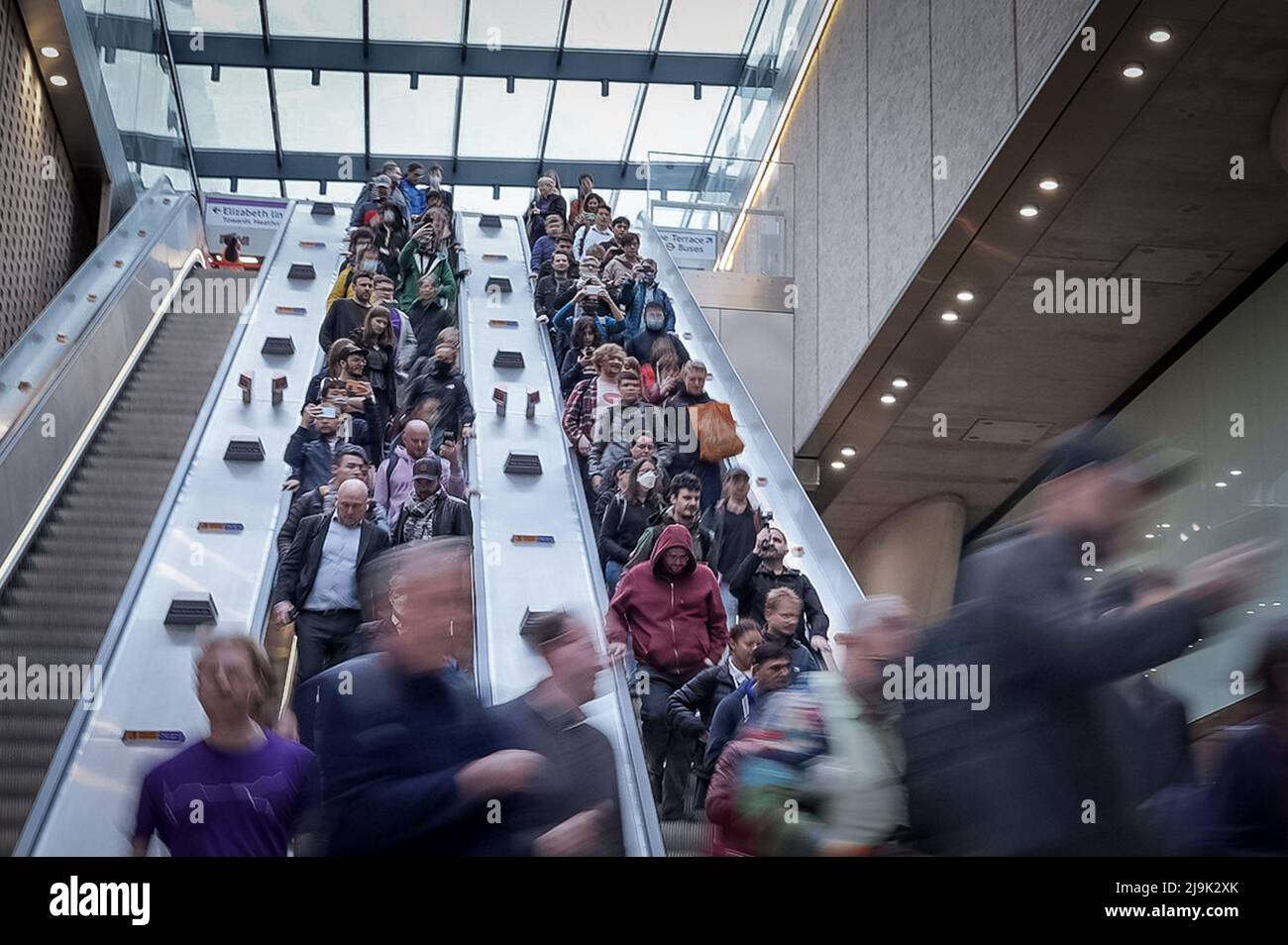 London, UK. 24th May 2022. Commuters ride one of the first escalators ...