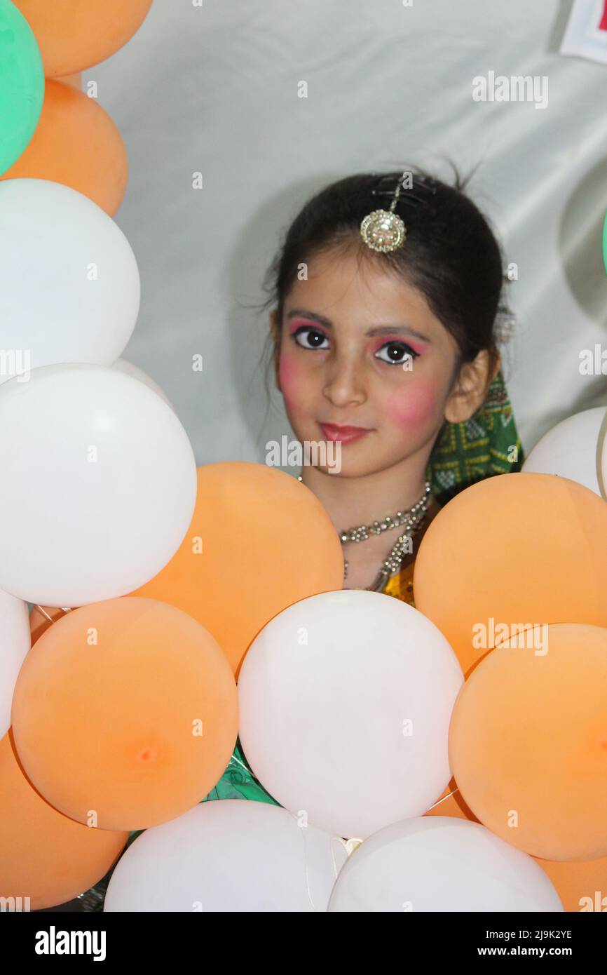 Indian Portrait with tri colour balloons - Saluting national Flag and ...
