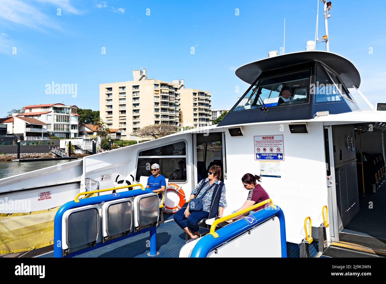 Brisbane Australia / A fast City Cat Ferry carries passengers along the ...