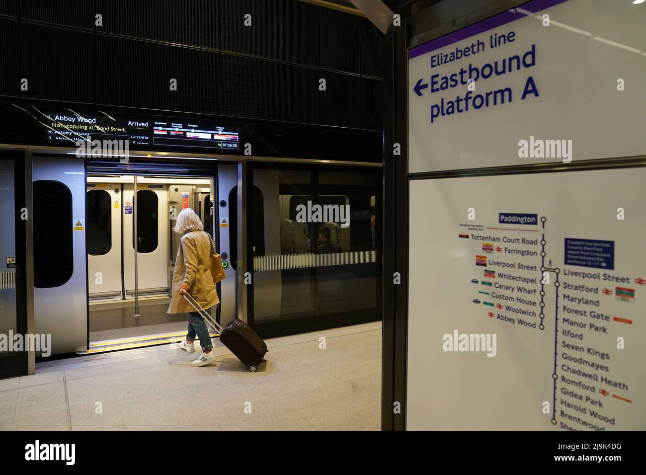 A passenger boards an Elizabeth Line carriage at Paddington Station ...