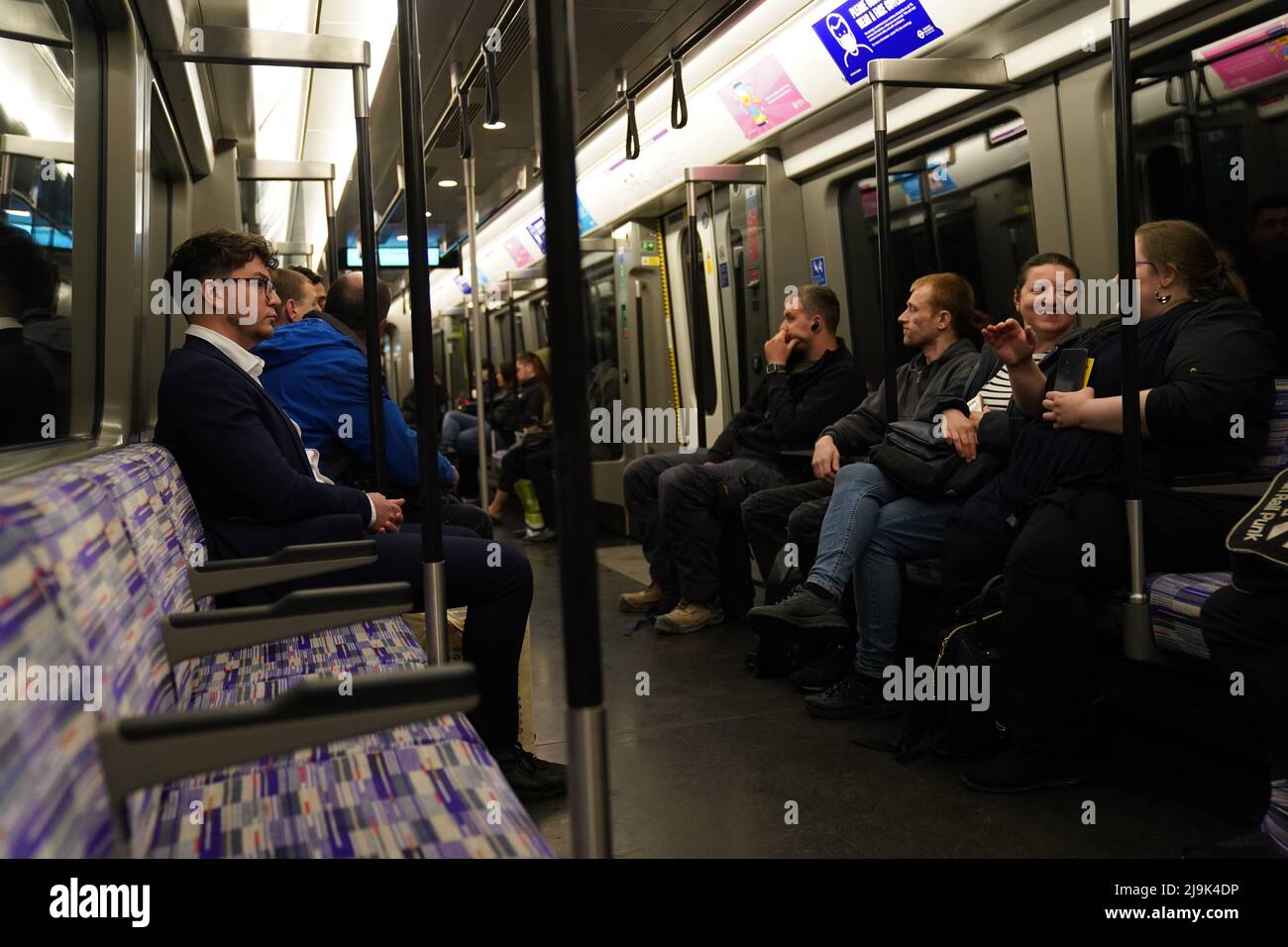 Passengers on board an Elizabeth Line train in London, as the new line ...
