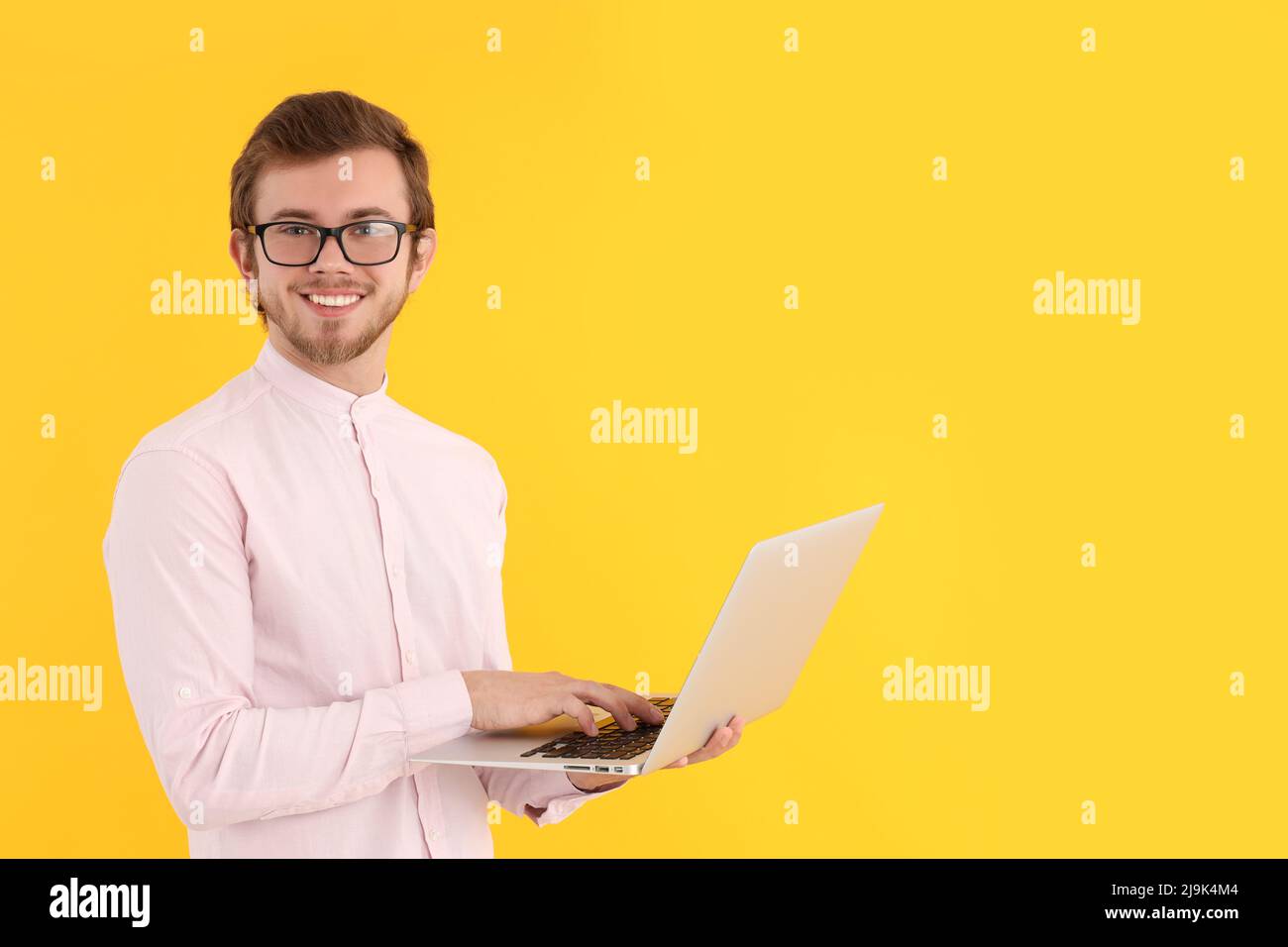 Concept of people, young man on yellow background Stock Photo - Alamy