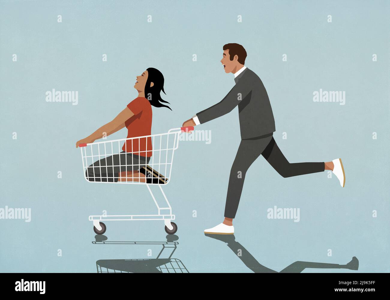 Man pushing happy, carefree woman in shopping cart Stock Photo - Alamy