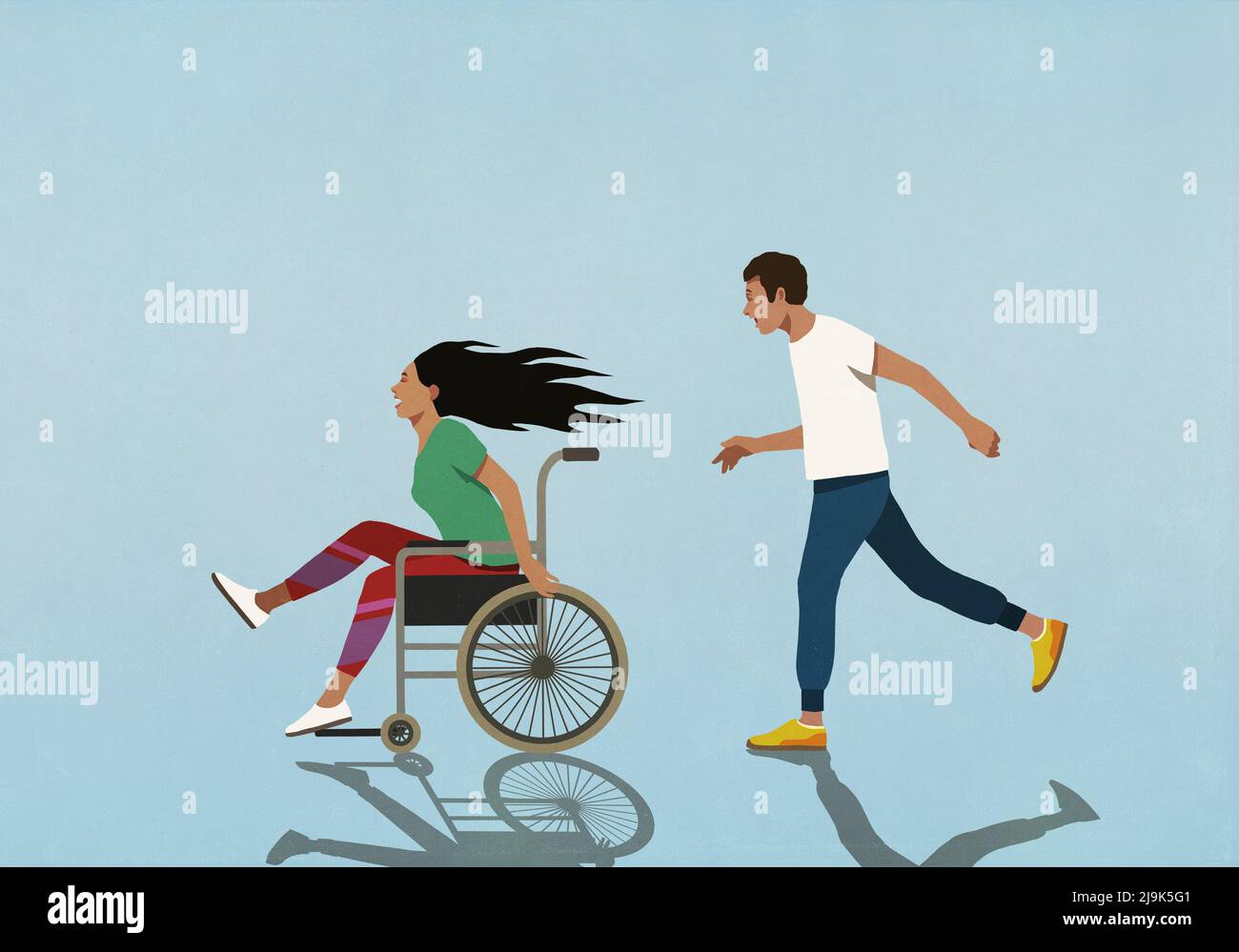 Man chasing carefree woman speeding in wheelchair Stock Photo - Alamy