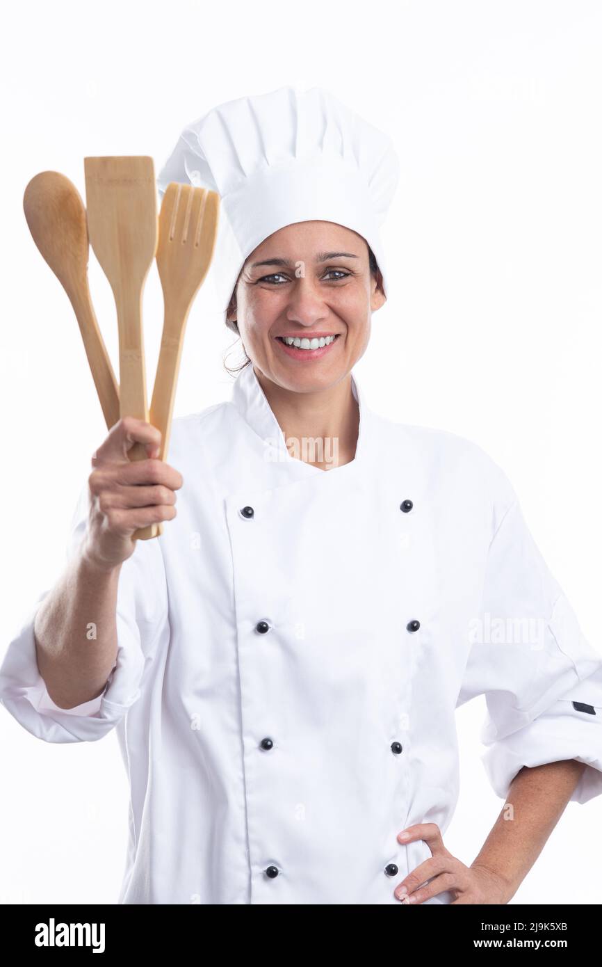 Happy young caucasian woman chef smiling at camera with chef outfit ...