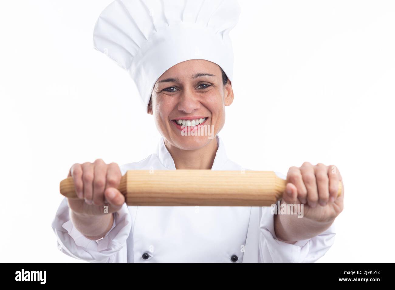 Happy caucasian woman dressed as chef showing kitchen utensil looking ...