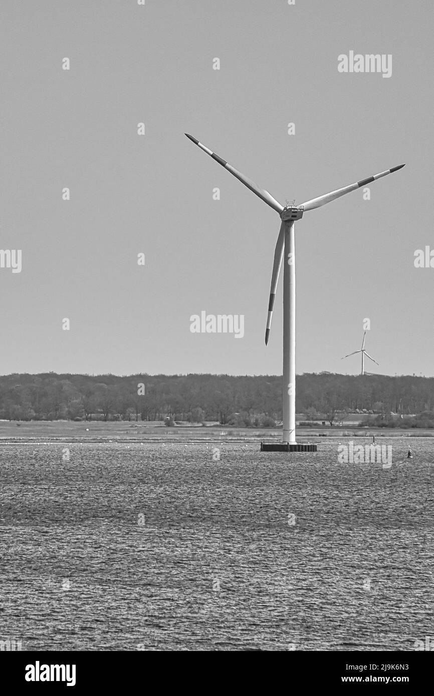 offshore wind turbine in black white. Green energy of the future ...