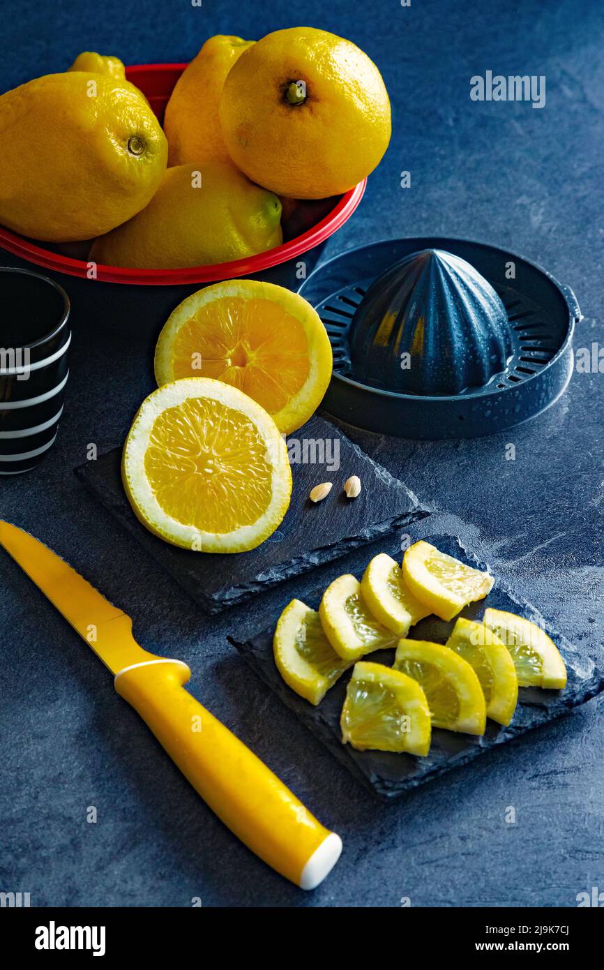Elegant background design of lemons and lemon slices with squeezer and ...