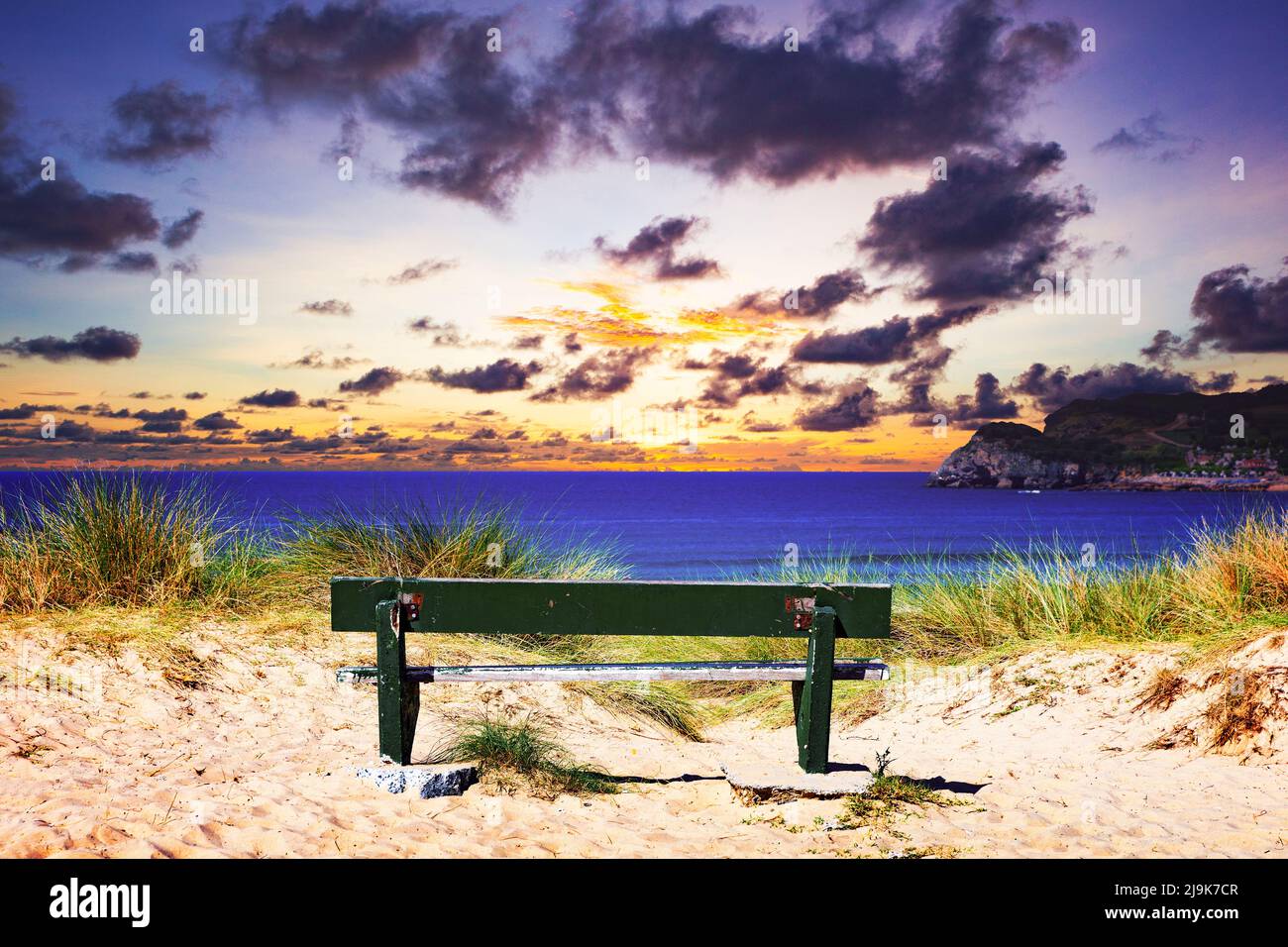 Park bench at the edge of the cliff with view to the sea. Romantic ...