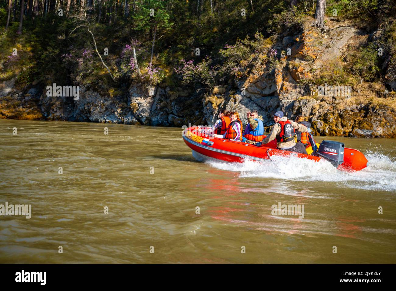 Altai, Russia - May 6, 2022: Red inflatable boat with people on the ...