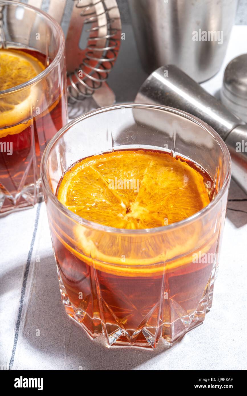Hard alcohol drink with orange slice garnish. Negroni cocktail with ...