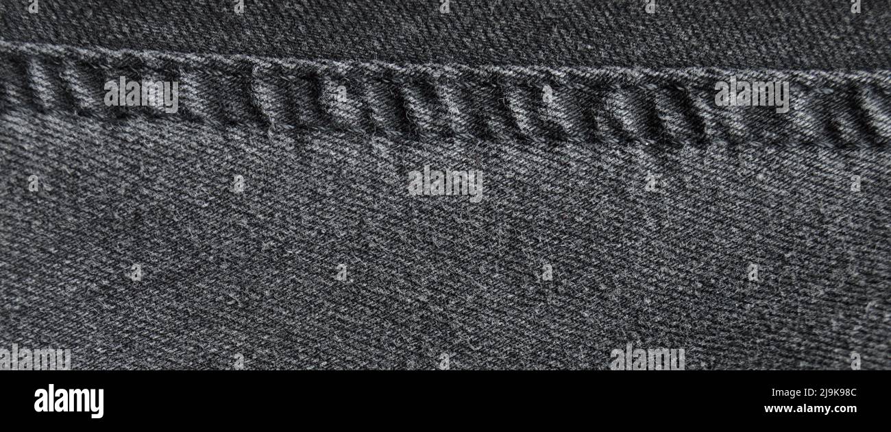 Seam black denim cotton jeans fabric texture background and wallpaper ...