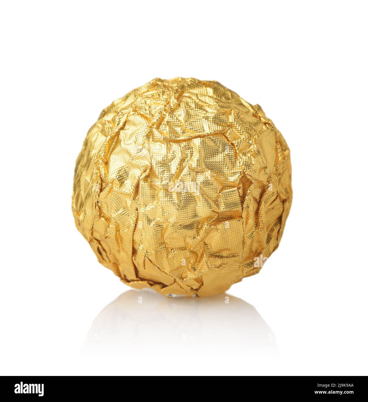 Front view of single chocolate ball candy in gold foil wrapper isolated ...