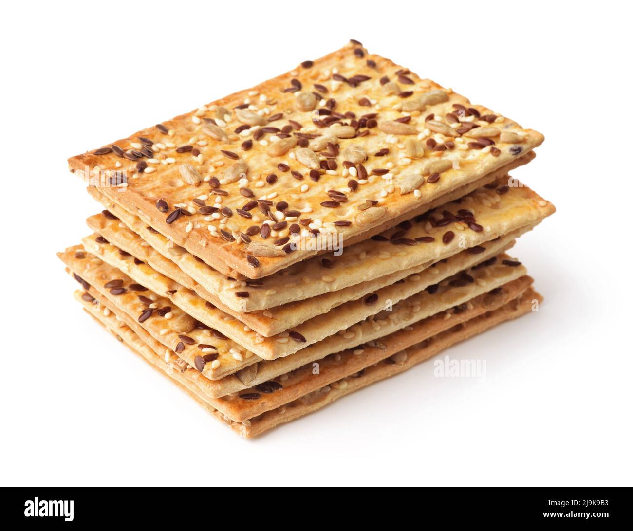 Stack of whole grain crispbread with various seeds isolated on white ...