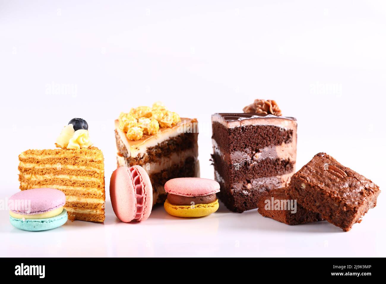 assortment of cakes desserts on white background Stock Photo - Alamy