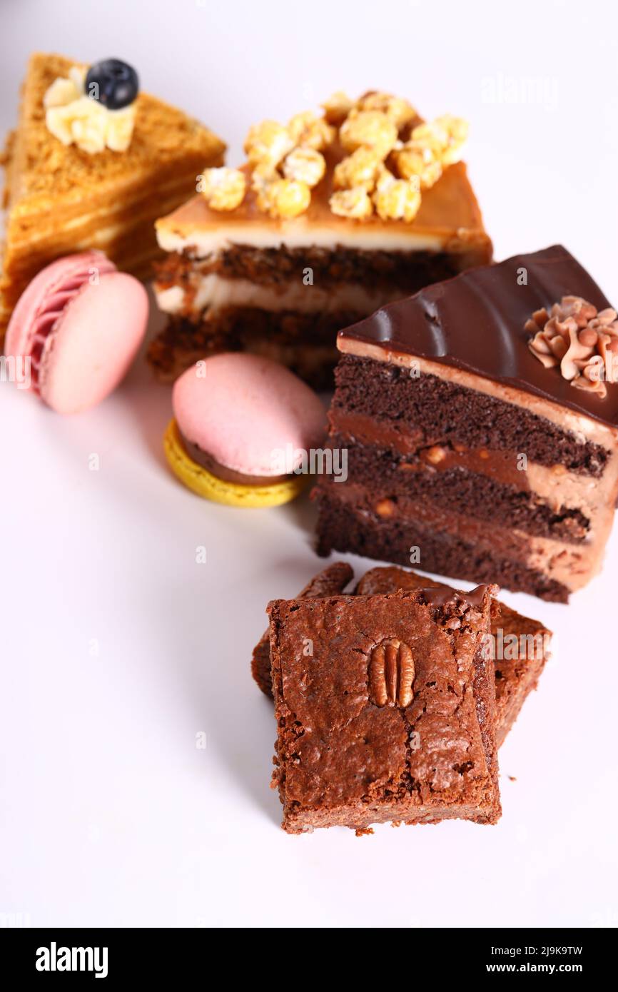 assortment of cakes desserts on white background Stock Photo - Alamy
