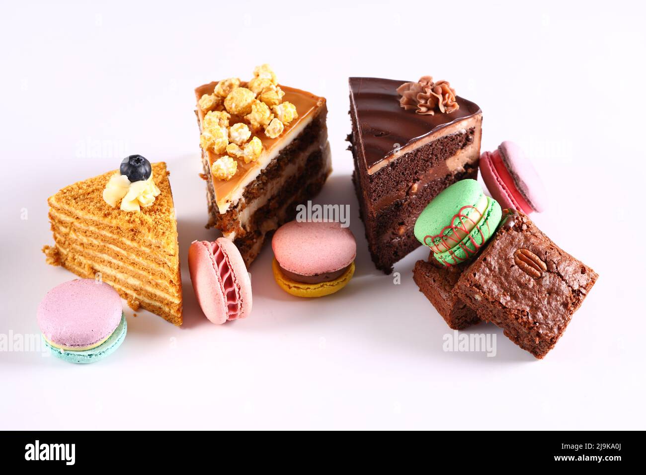 assortment of cakes desserts on white background Stock Photo - Alamy