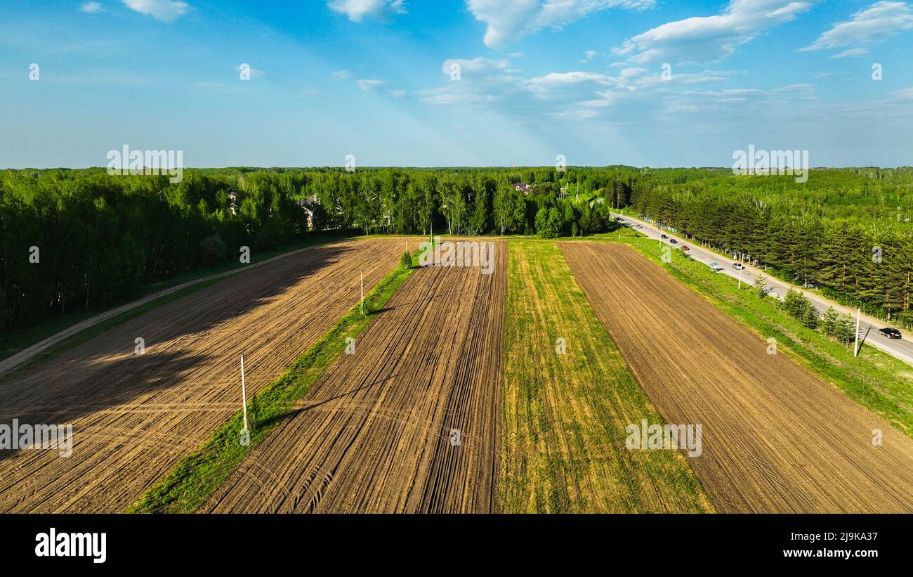 Aerial view of a land with sown fields in countryside. Landscape ...