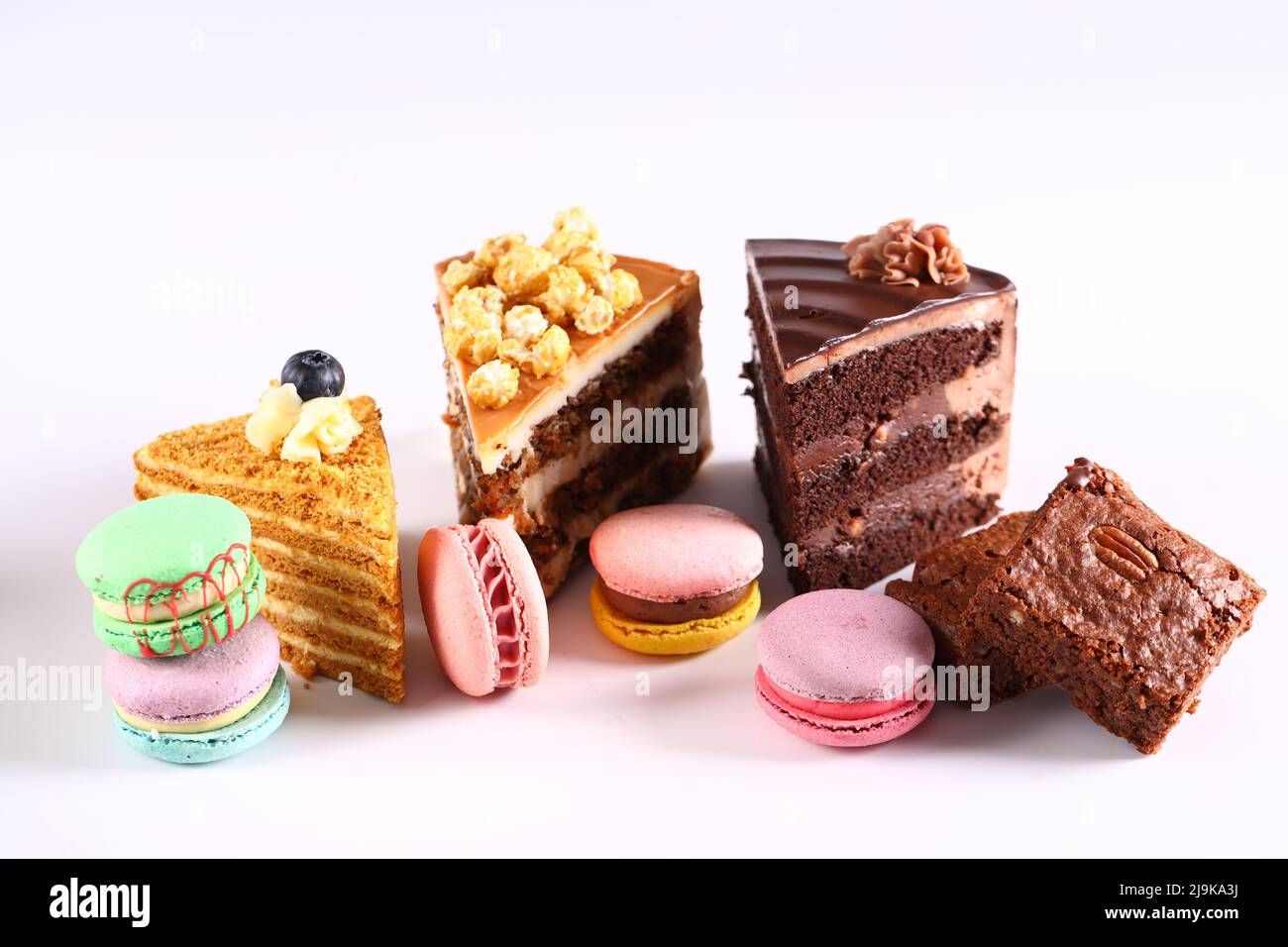 assortment of cakes desserts on white background Stock Photo - Alamy