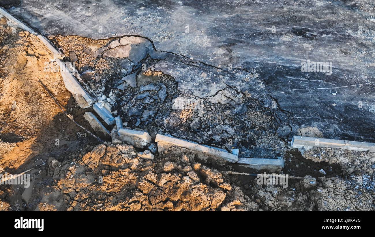 Asphalt destruction close-up. Pothole and pit on road Stock Photo - Alamy