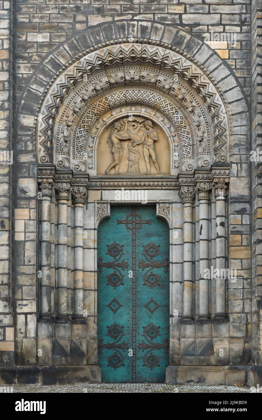 Adam and Eve depicted in the Romanesque revival portal of the Church of ...