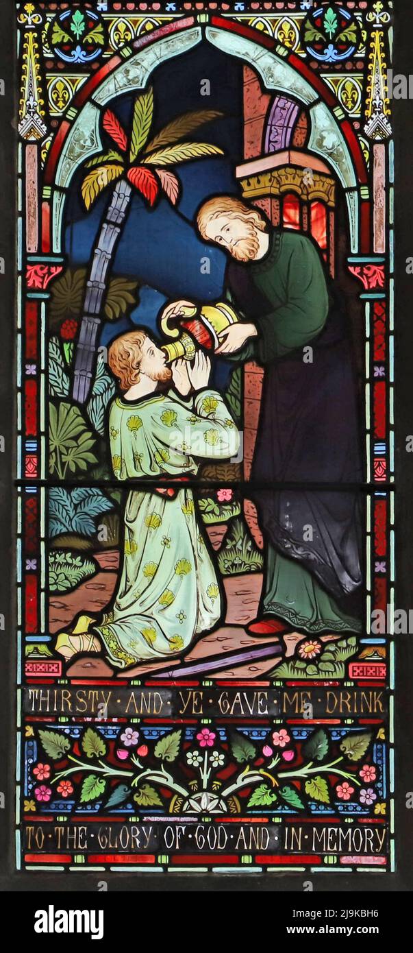 A stained glass window by Frederick Preedy depicting Corporal Acts of ...