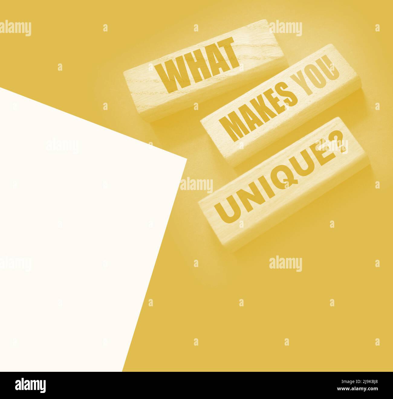 What makes yiu unique - phrase on Wooden blocks. Business or carees ...