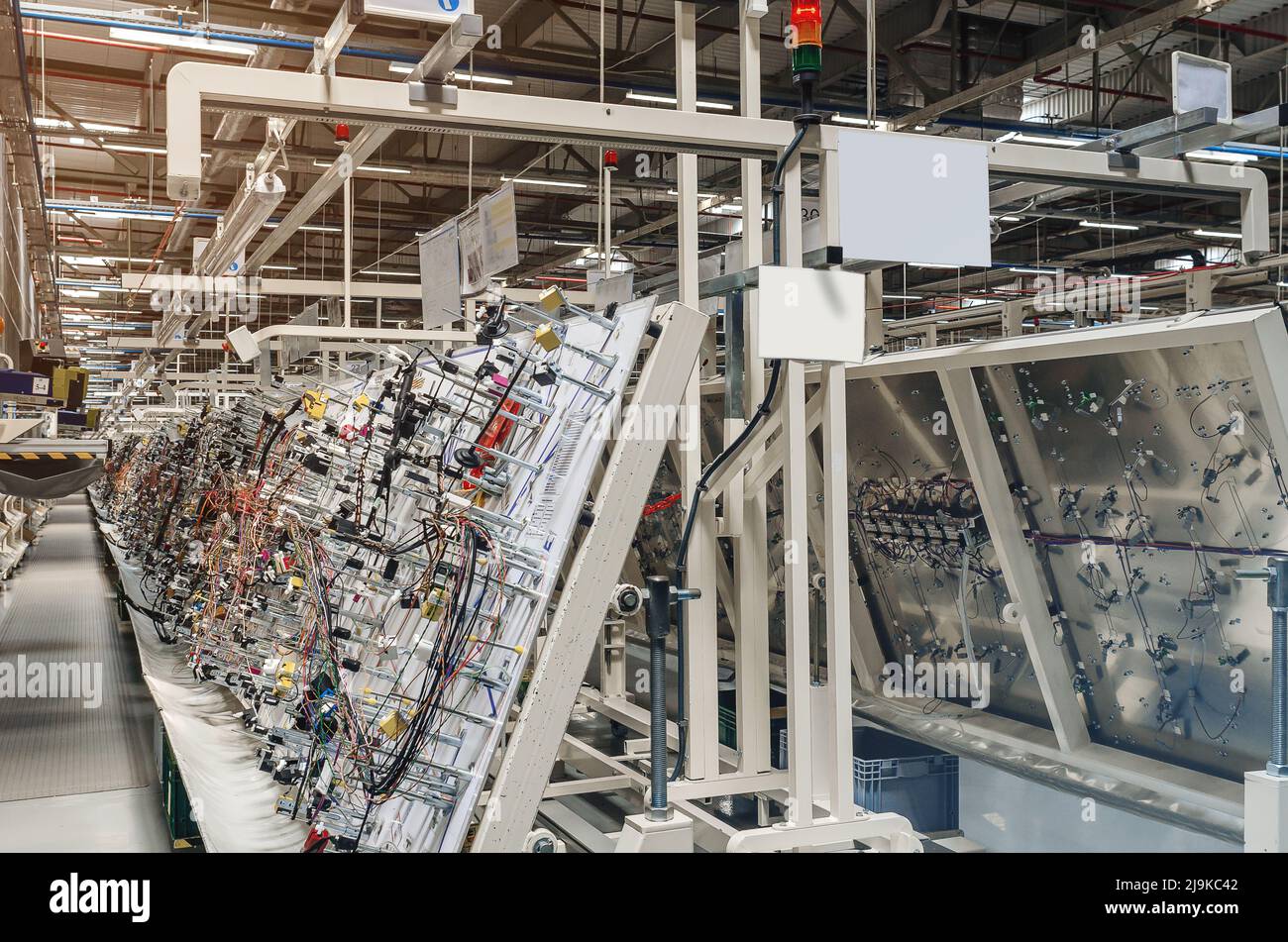 Side view of production room with stands for manufacture of electrical ...