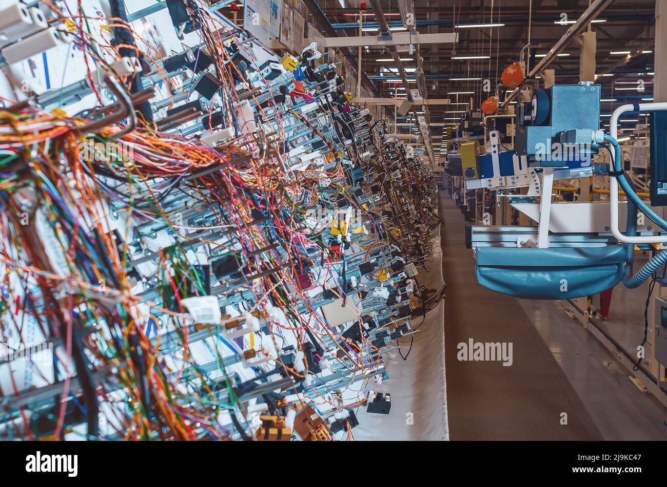 Production room with stands for manufacture of wiring for cars in ...