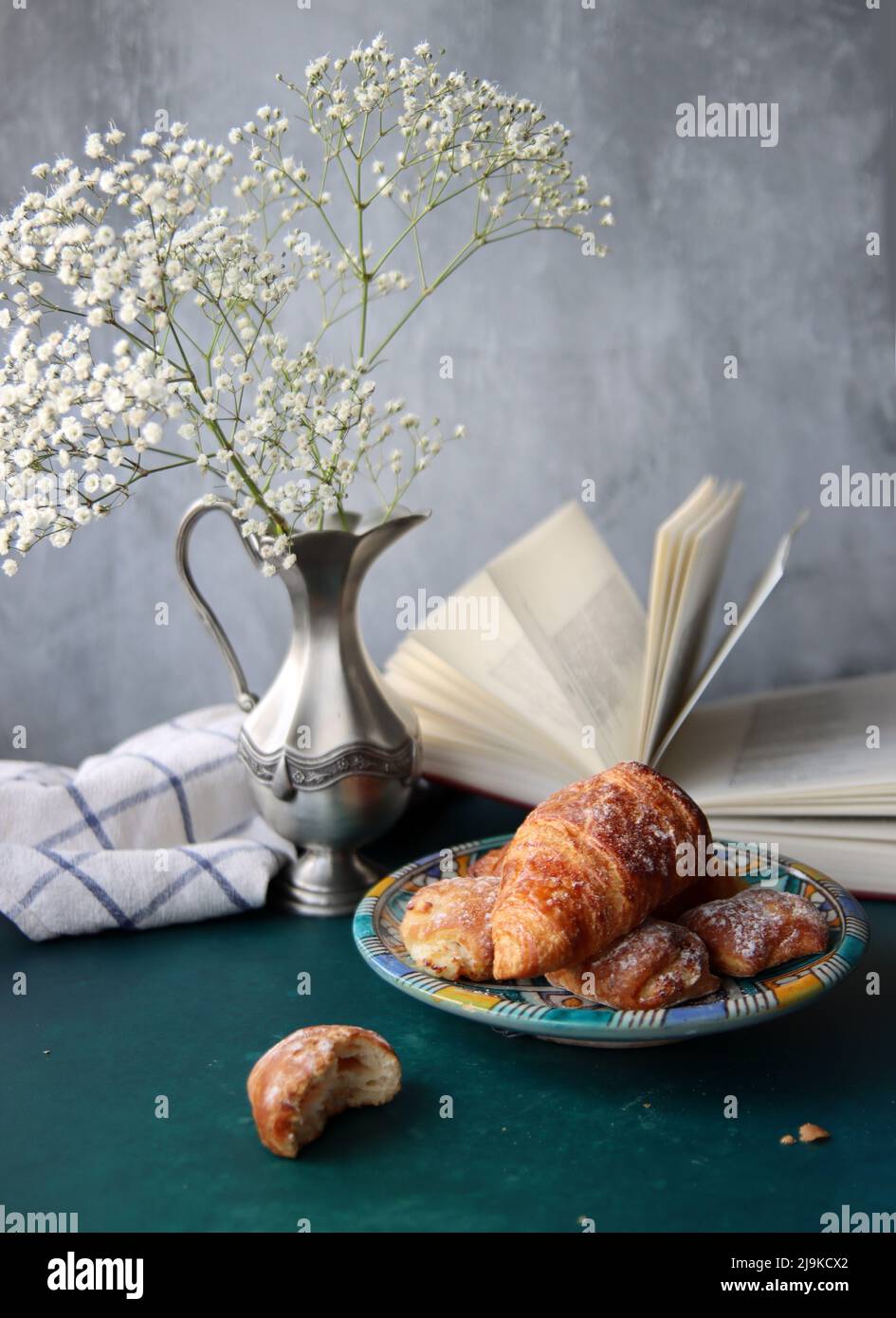 Good morning! Black coffee and croissants on a table. Sunny picture ...