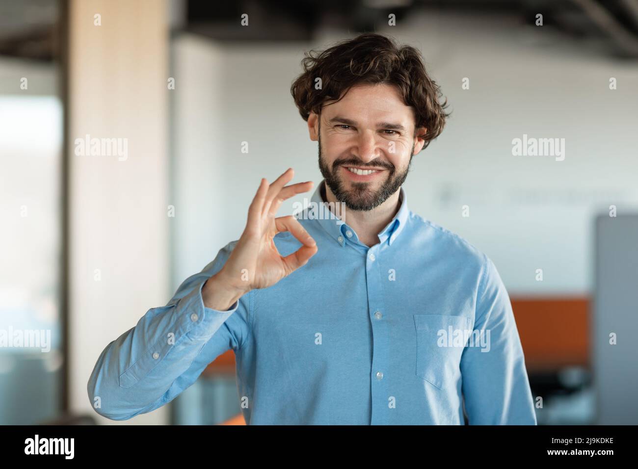 Cheerful businessman showing okay hi-res stock photography and images ...