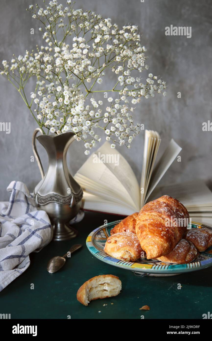 Good morning! Black coffee and croissants on a table. Sunny picture ...