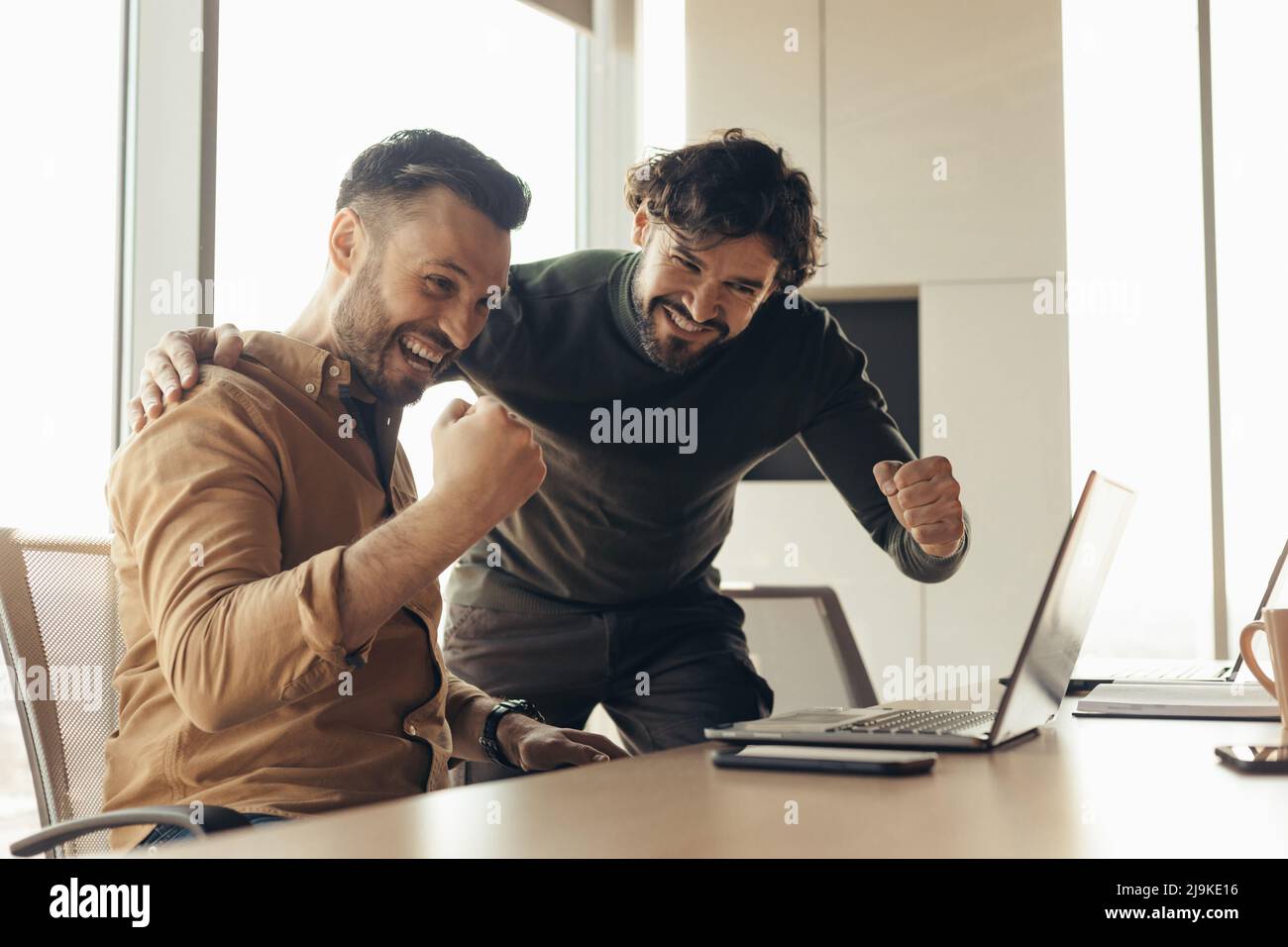 Business success. Coworkers celebrating achievement, making profitable ...