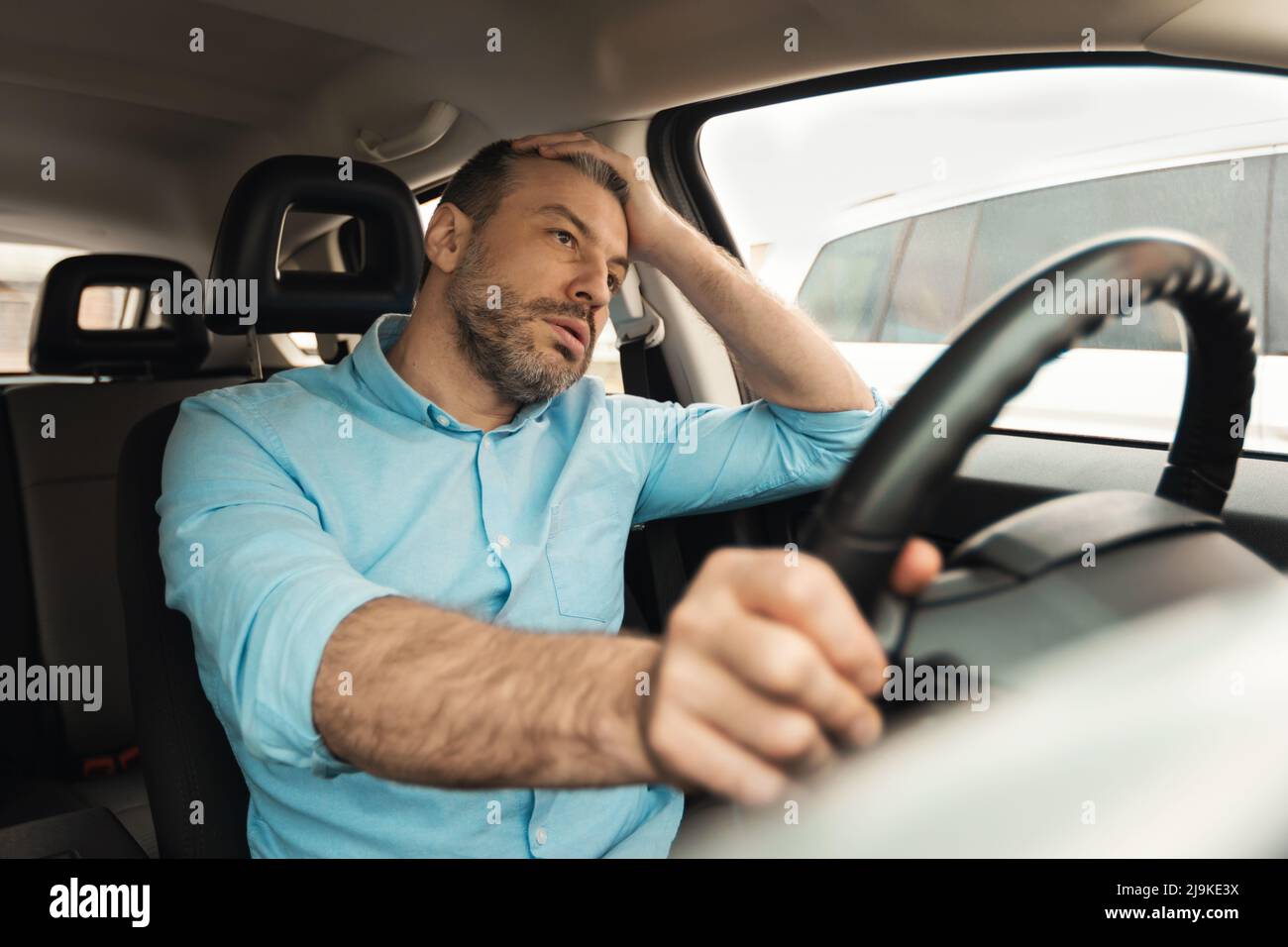 Sad man driving car hi-res stock photography and images - Alamy